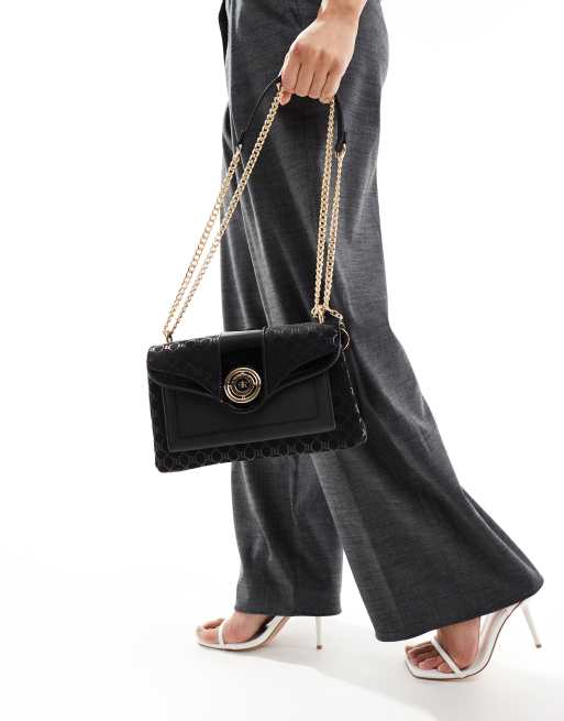 River Island monogram shoulder bag in black | ASOS