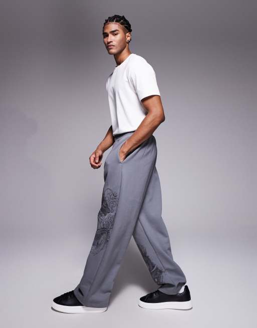 River Island wide leg dragon print trackies in grey | ASOS