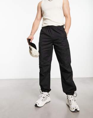 River Island zip pocket cargos in black | ASOS