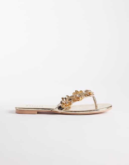 Simmi London Carissa toe thong flat sandals with appliques in gold | ASOS