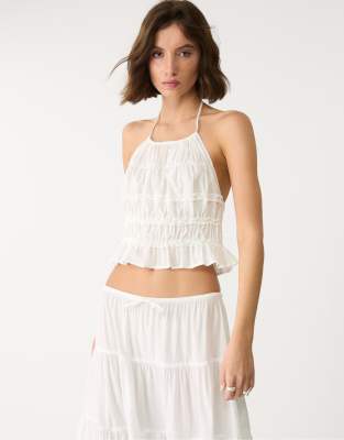 Stradivarius halter top with open back in ecru | ASOS