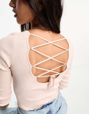 Stradivarius knitted top with cross back detail in soft pink | ASOS