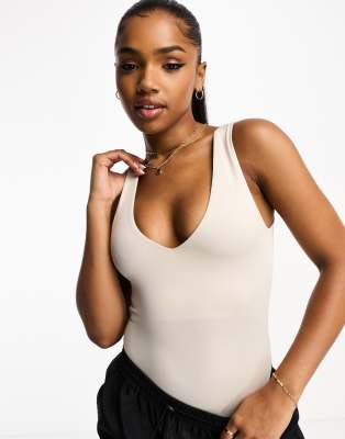 Stradivarius v neck seamless bodysuit in beige | ASOS
