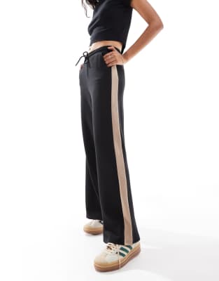 Stradivarius wide leg side stripe trackies in black | ASOS