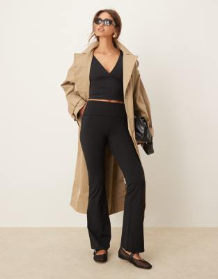 Tala DayFlex multiway fold waist flared yoga pant in black | ASOS