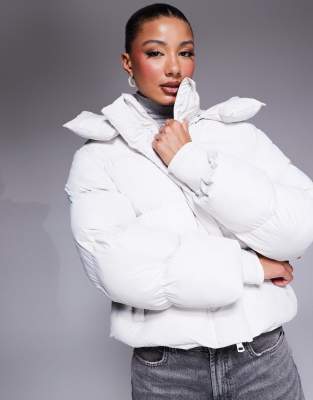 The Couture Club cold reactive emblem puffer in off white | ASOS