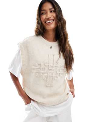 The Couture Club emblem knitted vest in white | ASOS