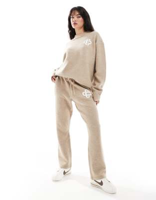 The Couture Club fluffy emblem knitted pants in beige | ASOS