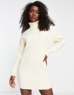 The Frolic cable knit roll neck mini sweater dress in cream | ASOS