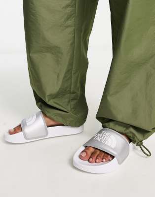 The North Face Base Camp III logo metallic sliders in white and silver ...