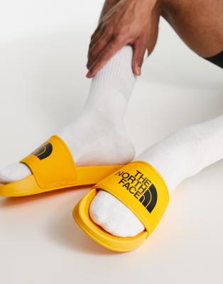 The North Face Base Camp III sliders in yellow | ASOS