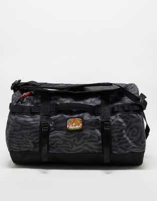 The North Face Base camp small duffel in black tiger print | ASOS
