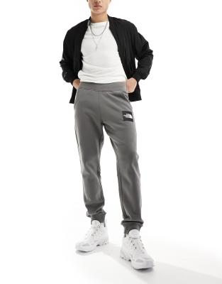 The North Face NSE Alpine trackies in grey | ASOS