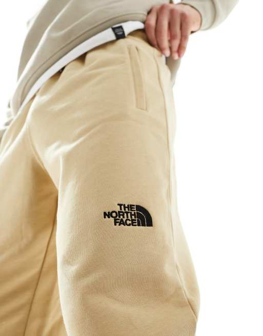 The North Face NSE Fleece Jogginghose in Steinbeige