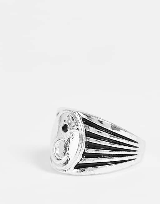 The Status Syndicate oval signet ring with moon and star detail in ...
