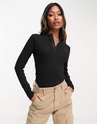 Threadbare - Body côtelé à manches longues et col montant avec demi-fermeture éclair - Noir | ASOS