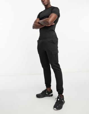 Threadbare Fitness slim fit cargo trackies in black | ASOS