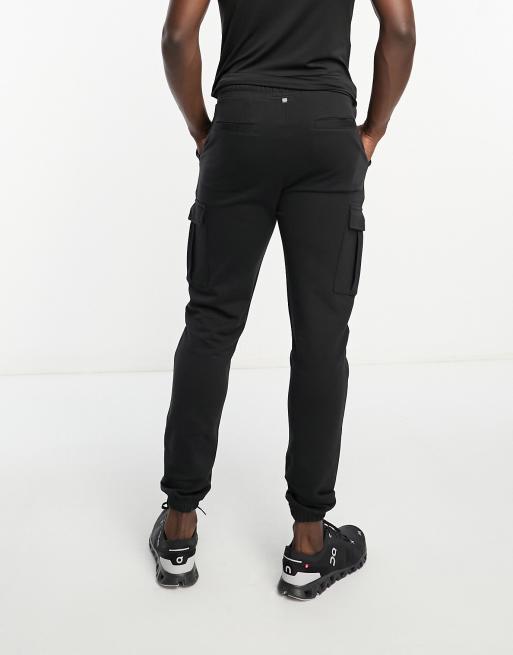 Threadbare Fitness slim fit cargo trackies in black | ASOS