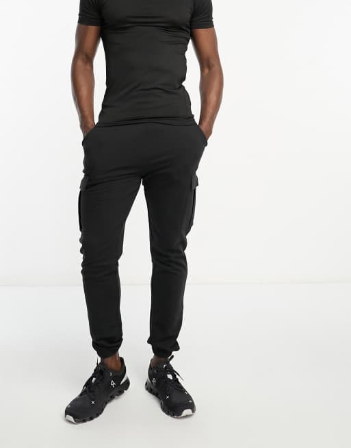 Threadbare Fitness slim fit cargo trackies in black | ASOS
