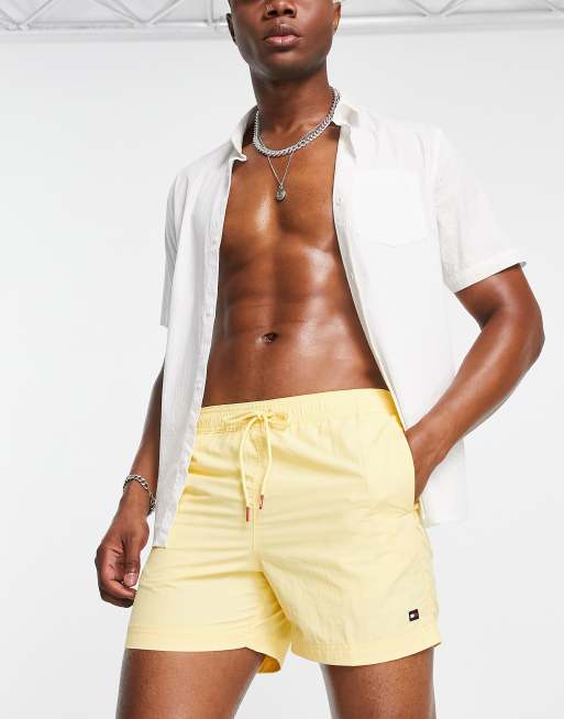 Tommy Hilfiger core flag logo nylon swim shorts in yellow | ASOS