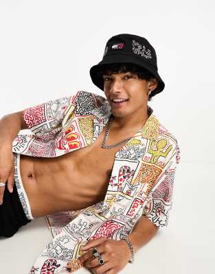 Tommy Jeans x Keith Haring graphic bucket hat in black | ASOS