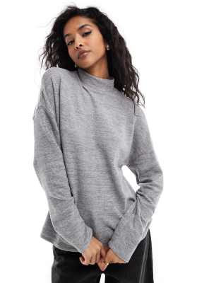 Top gris claro melange extragrande con cuello alto de punto liso de ...