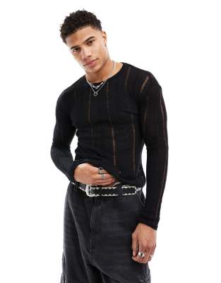 Top negro de manga larga y corte slim de punto transparente para ...