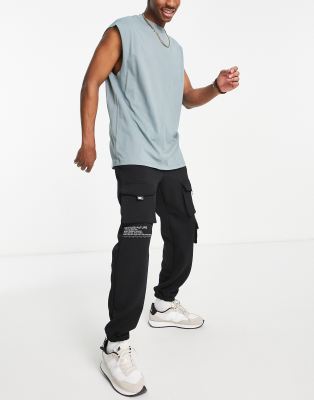 Topman cargo trackies with untitled print in black | ASOS