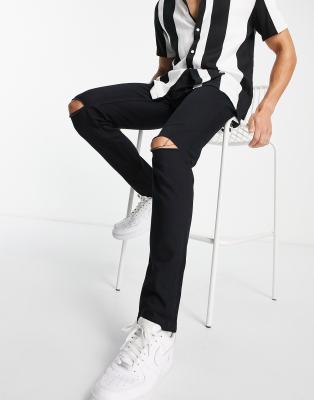 Topman knee rip stretch skinny jeans in black | ASOS