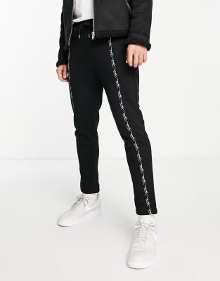 Topman Signature print sweatpants in black | ASOS