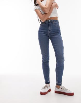 Topshop high rise Jamie jeans with let down hem in mid blue | ASOS