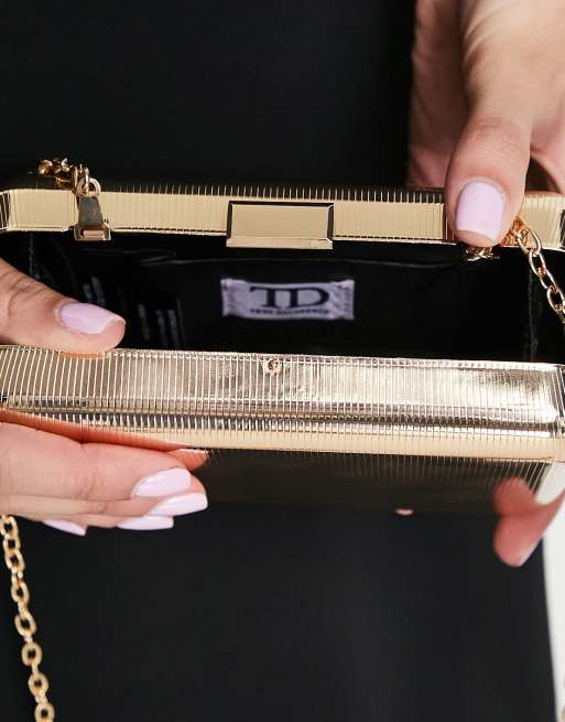 True Decadence metal clutch bag in embossed gold | ASOS