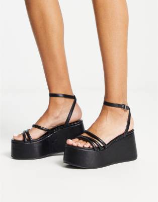 Truffle Collection extreme flatform heeled sandals in black | ASOS