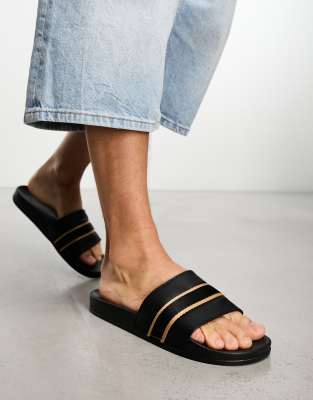 Truffle Collection gold print sliders in black | ASOS