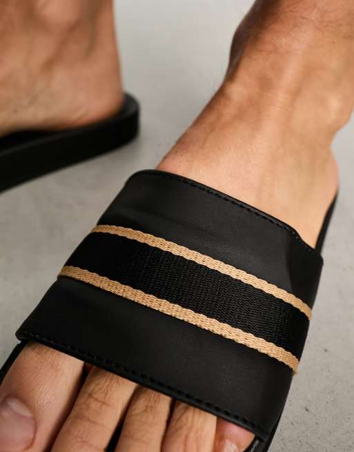Truffle Collection gold print sliders in black | ASOS