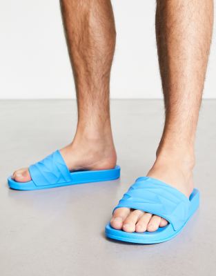 Truffle Collection grooved pool sliders in blue | ASOS