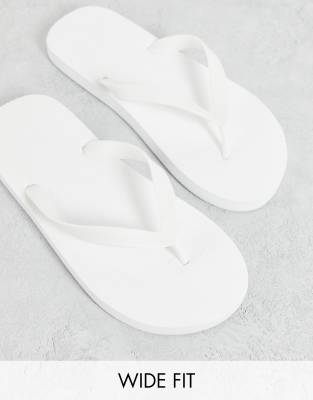 Truffle Collection wide fit flip flops in white | ASOS