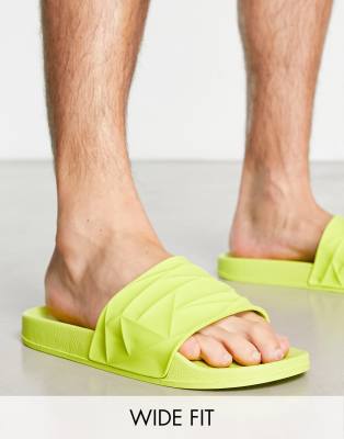 Truffle Collection wide fit grooved pool sliders in neon lime | ASOS