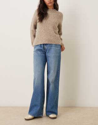 Vaqueros azules holgados de talle bajo con lavado medio de Calvin Klein ...