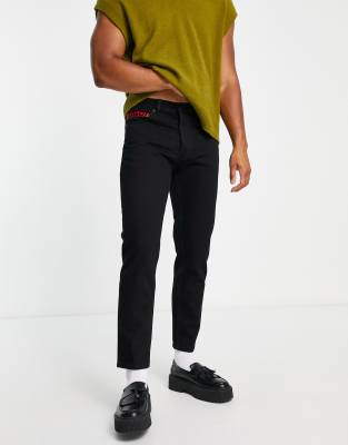 Vaqueros negros de corte tapered 634/3 de HUGO | ASOS