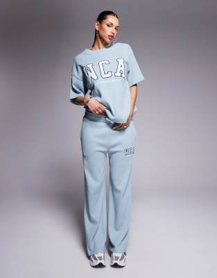 Weekend Collective co-ord waffle trackies with varsity logo in washed ...